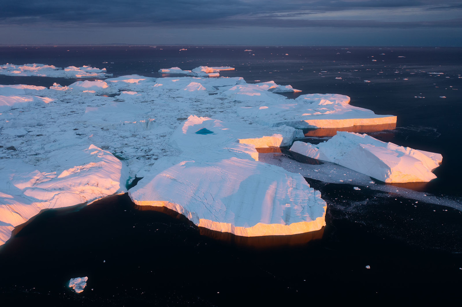 Incredible footage of a sudden iceberg collapse in Greenland | PetaPixel
