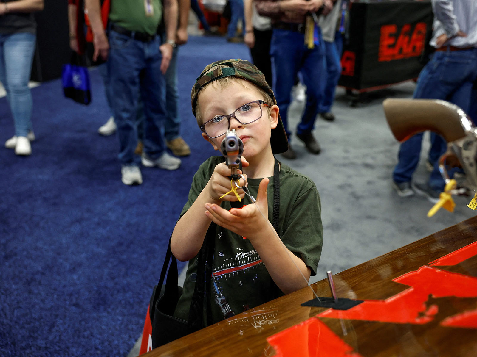 Photo of 6-Year-Old Boy Pointing Gun at Camera at NRA Event Sparks ...